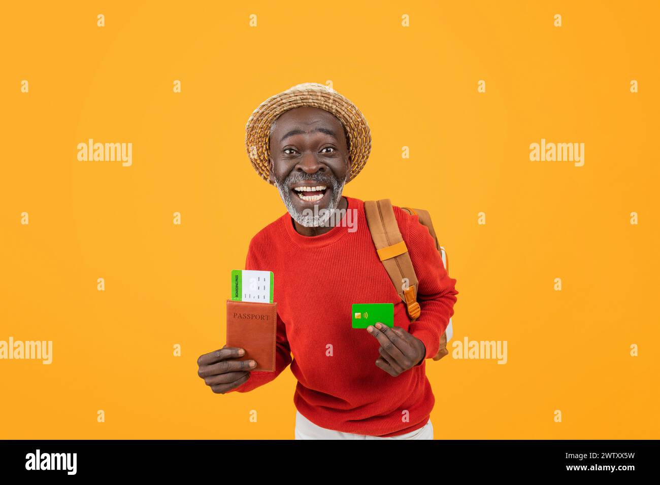 Travel-ready senior black man with a beaming smile, holding a passport ...