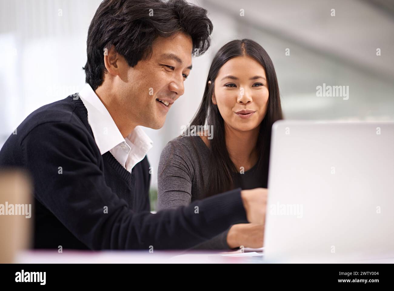 Laptop, asian business people and happy for teamwork on technology and ...
