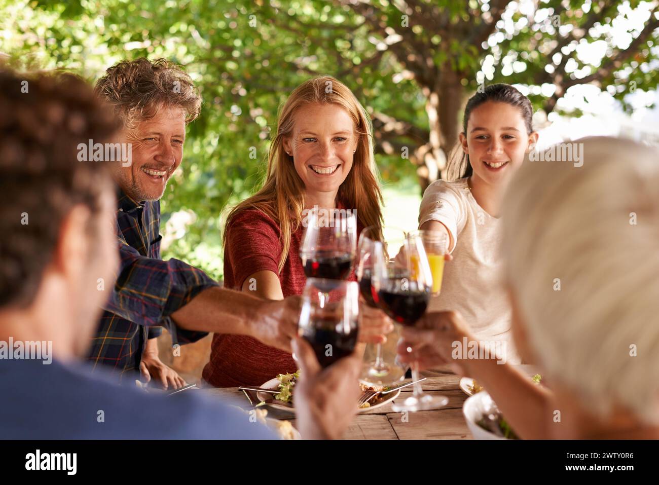 Family, lunch and cheers with happiness, celebration and bonding ...