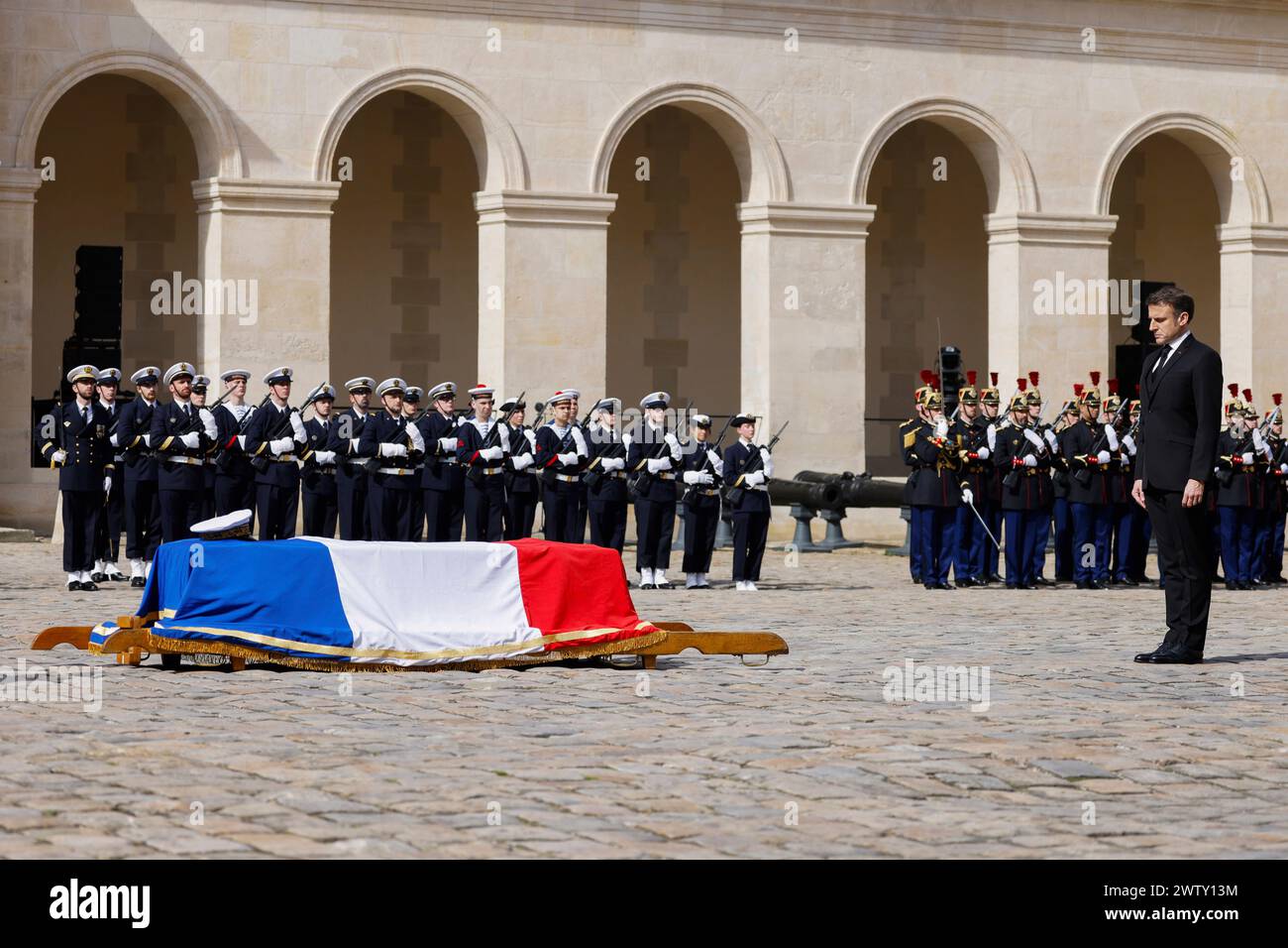 France's President Emmanuel Macron stands next to the coffin of late ...