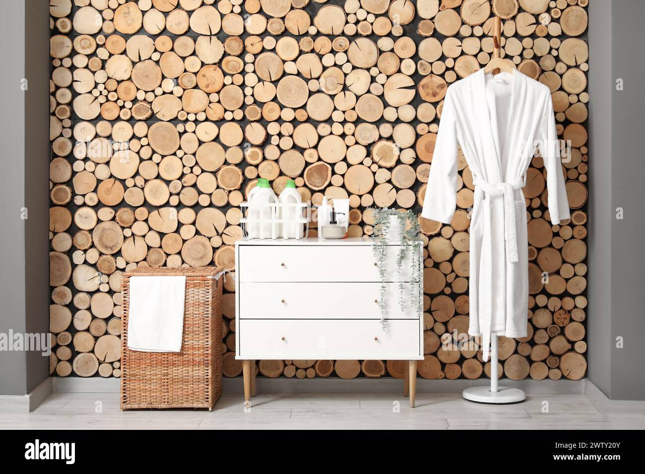 Interior of room with laundry basket, commode and bathrobe Stock Photo ...