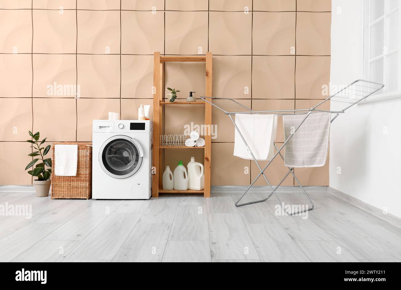 Interior of room with laundry basket, washing machine and dryer Stock ...