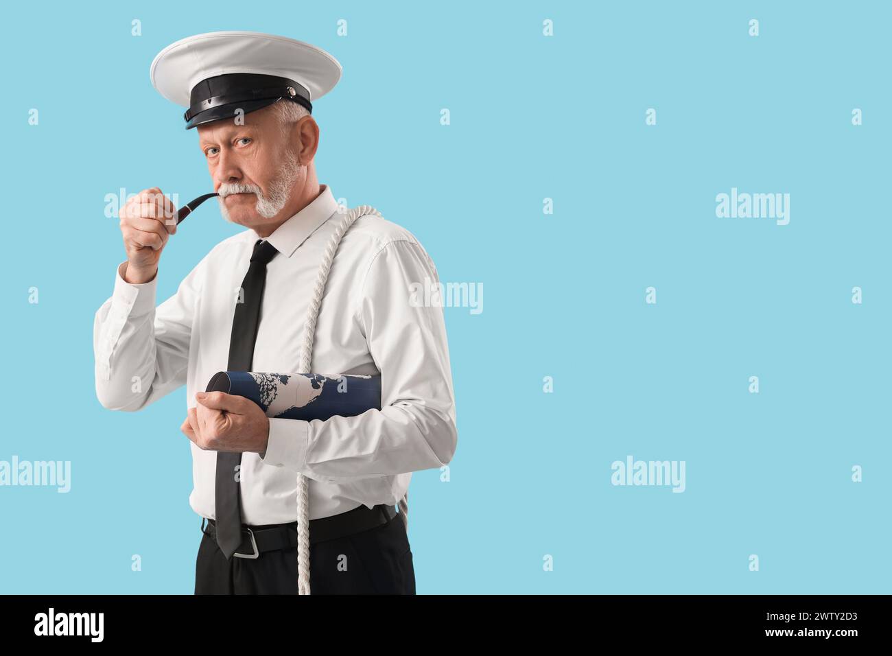 Mature sailor with rope and map smoking pipe on blue background Stock ...