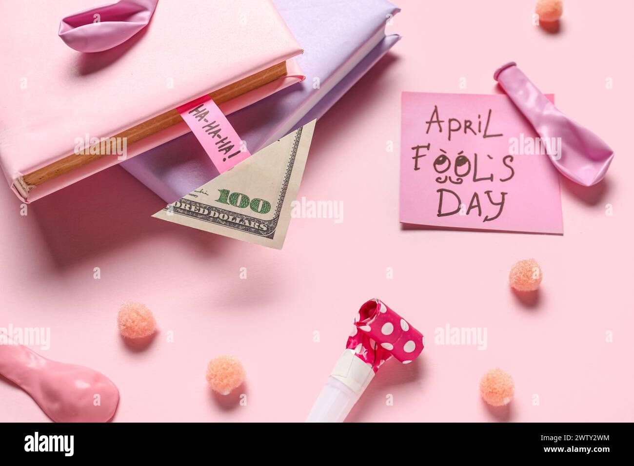 Money shaped bookmark, balloons and sticky note on pink background ...