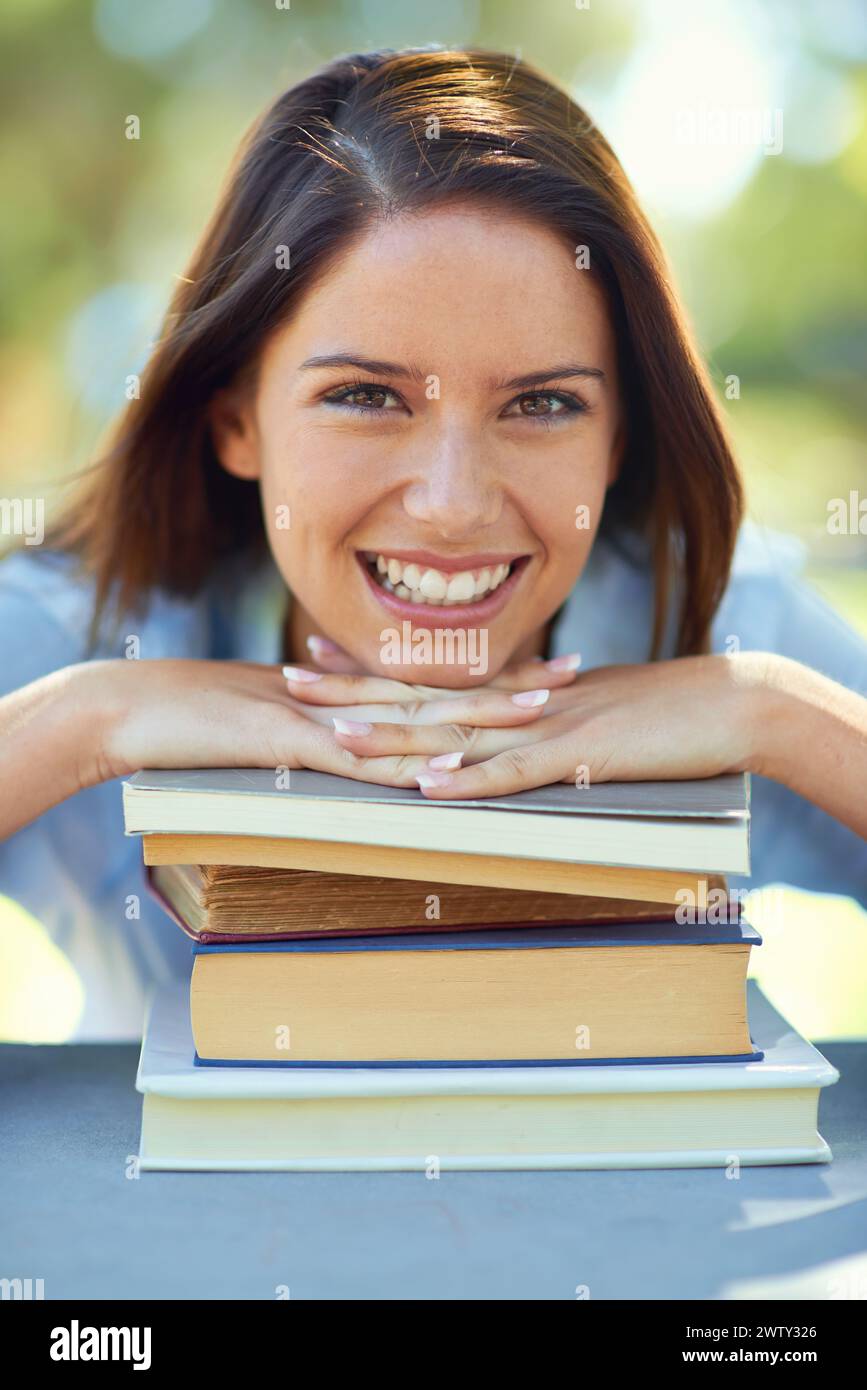Portrait, happy woman or books at university campus for studying ...