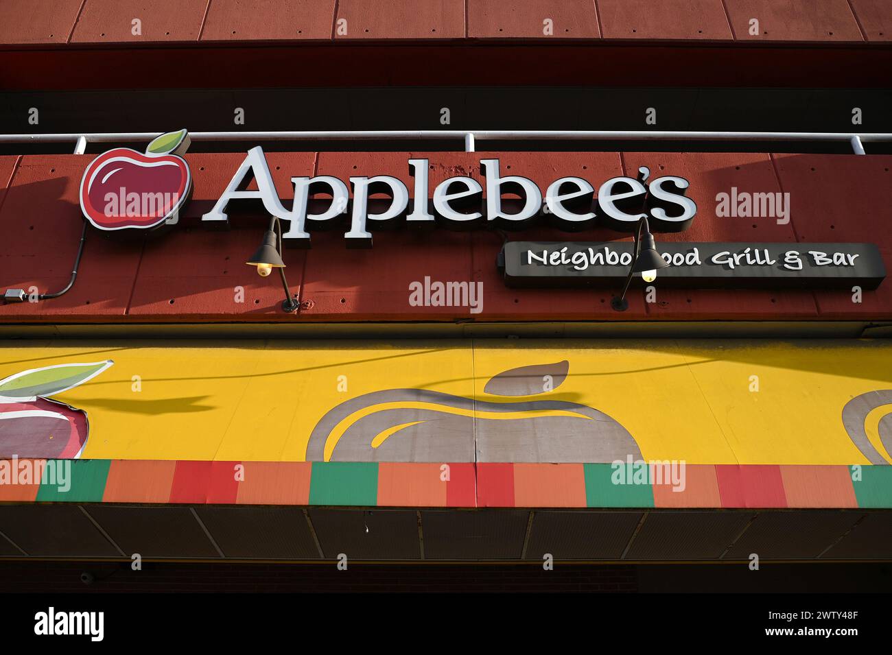 New York, USA. 18th Mar, 2024. View of the Applebee's logo above the entrance to their Queens ...