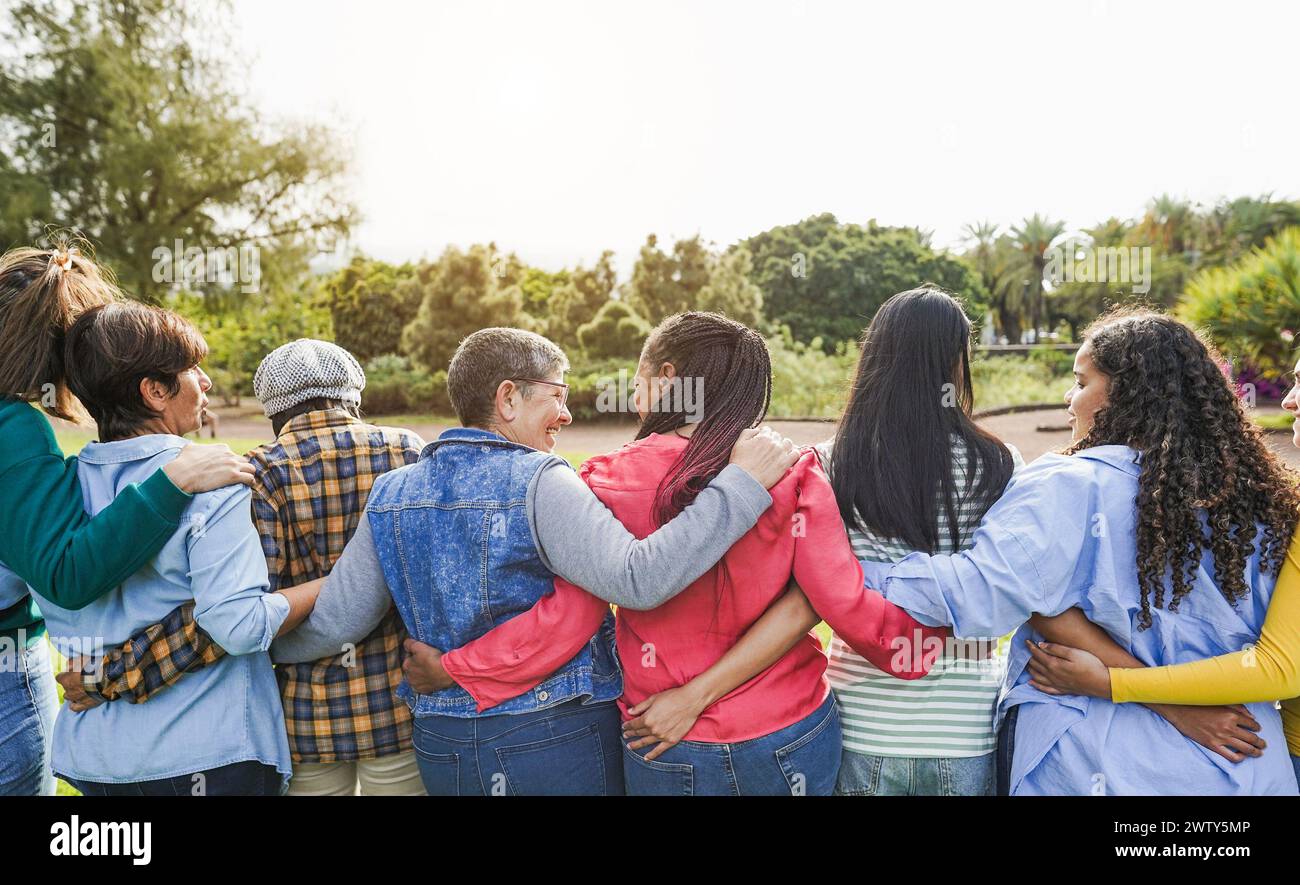 Multi generational women hugging each others - Female multiracial group ...