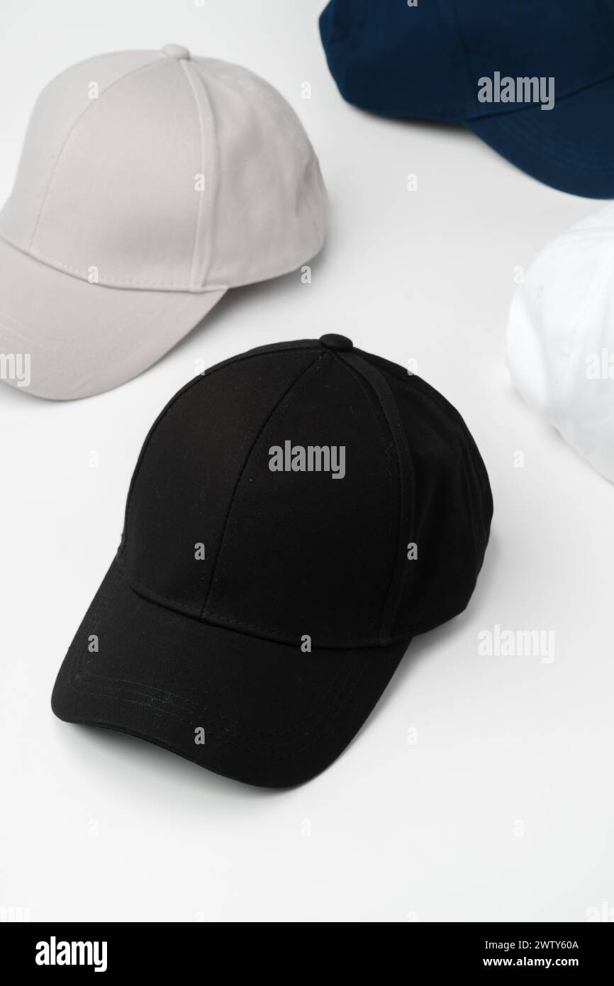 Different Colors of Hats on a White Background Stock Photo - Alamy
