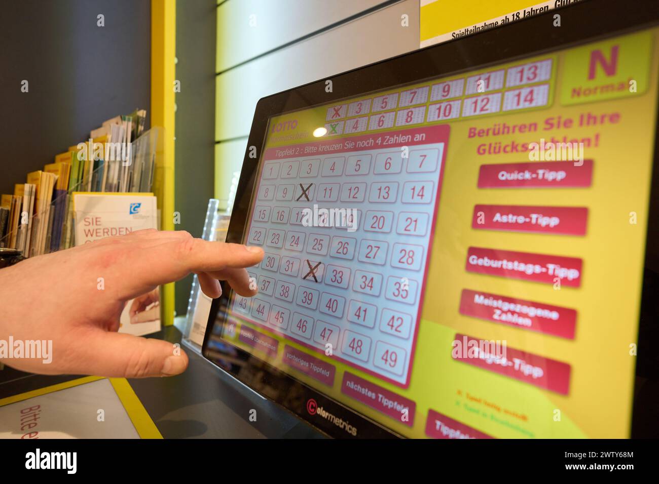 Koblenz, Germany. 18th Mar, 2024. A lottery player uses an electronic ...