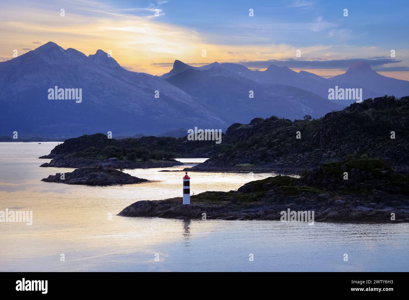 Midsummer sun on the sky in the fjord Vestfjorden near the Lofoten ...