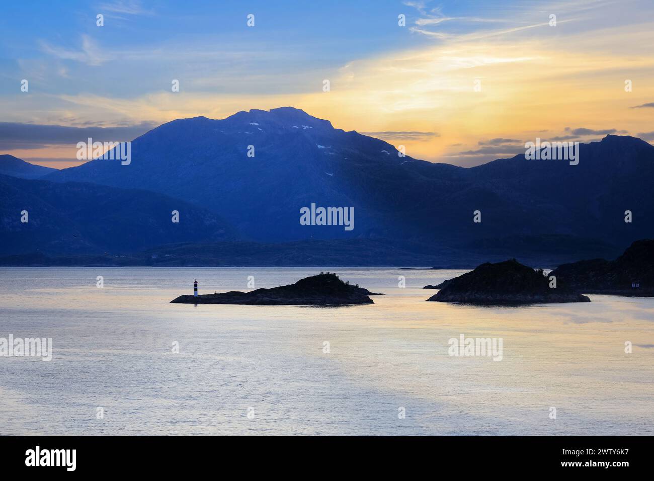 Midsummer sun on the sky in the fjord Vestfjorden near the Lofoten ...
