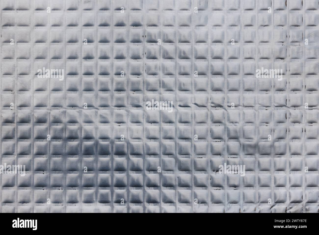 Closeup full-frame background and texture of aluminum coated butil ...