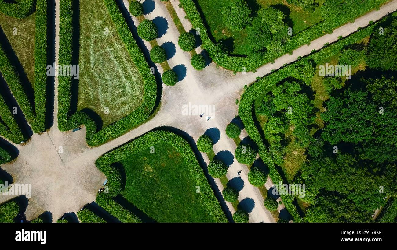 Top view of people walking on geometric garden paths. Creative ...