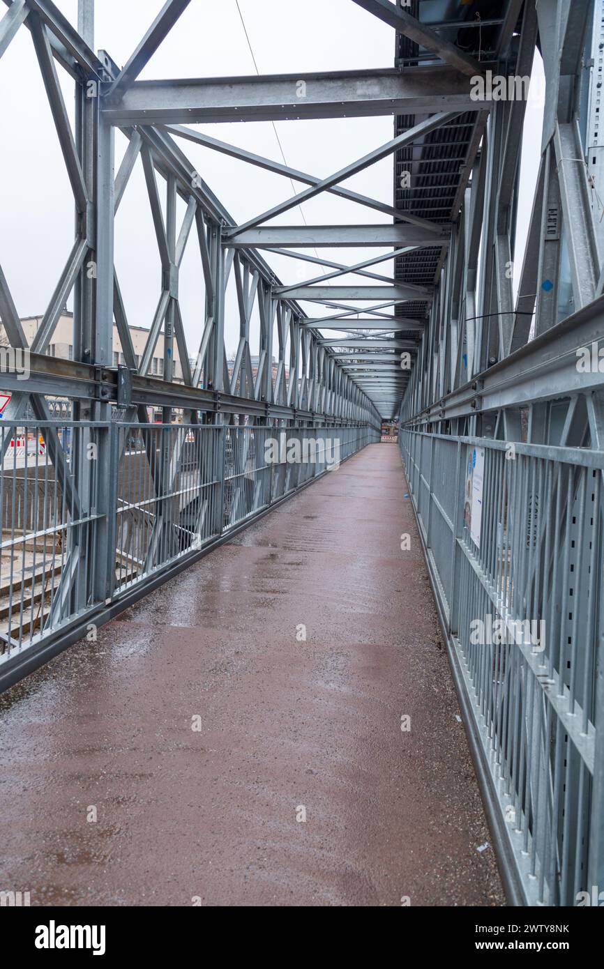 Munich, Germany - DEC 26, 2021: Metal pedestrian bridge over the Isar ...