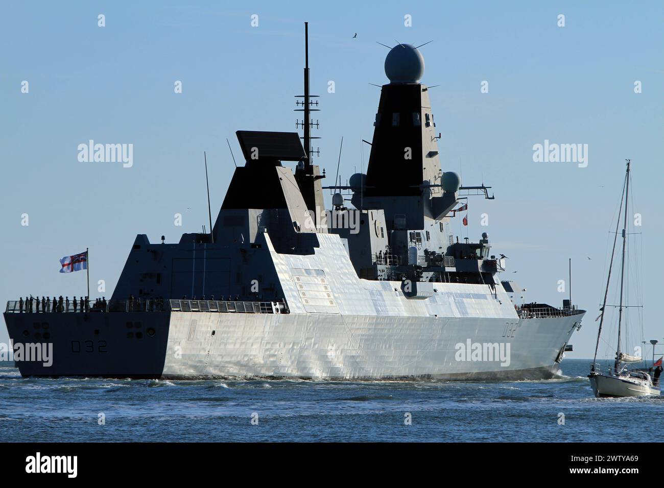10/01/12. ..HMS Daring slips out of Portsmouth Harbour into ThE Solent ...