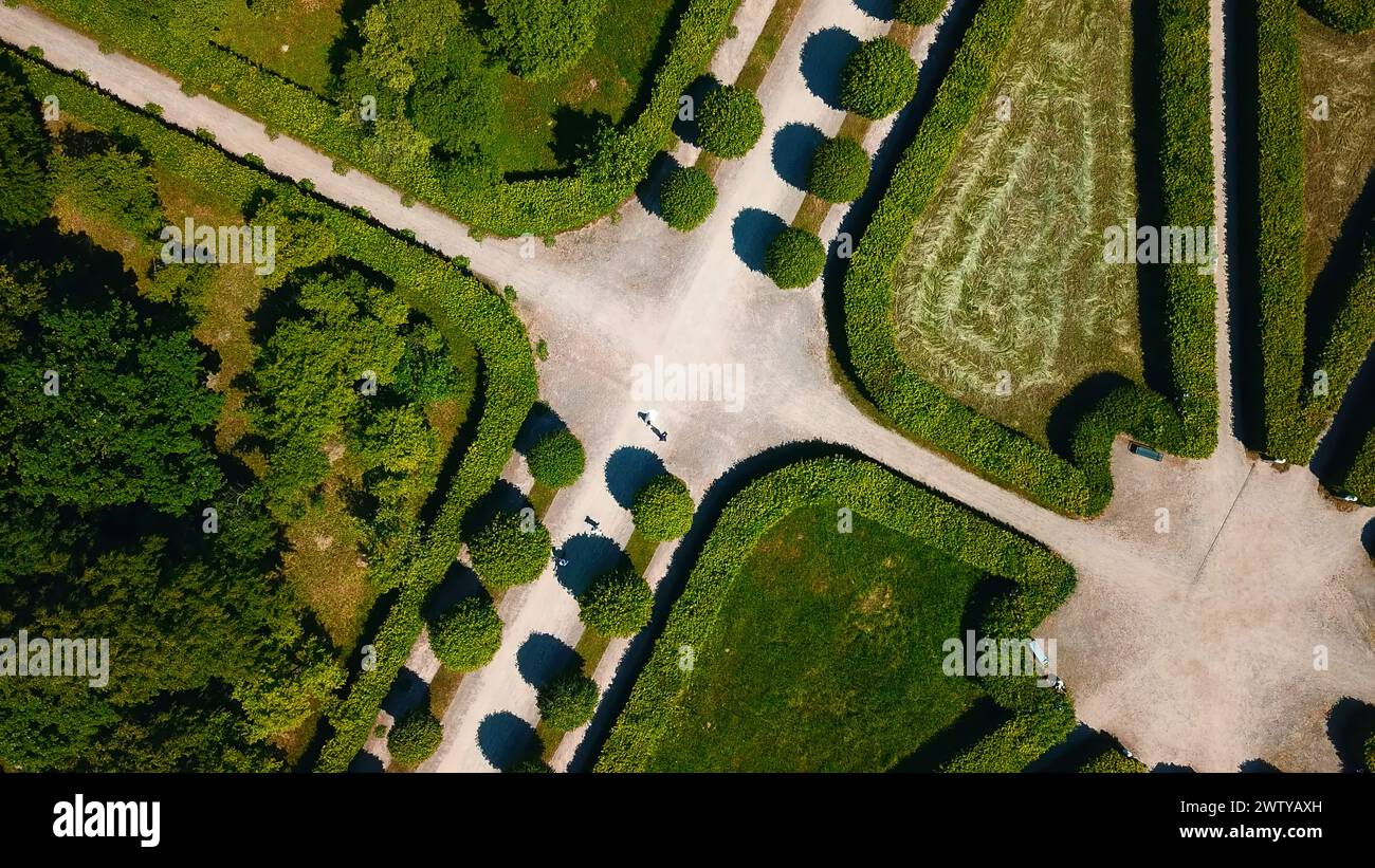 Top view of people walking on geometric garden paths. Creative ...