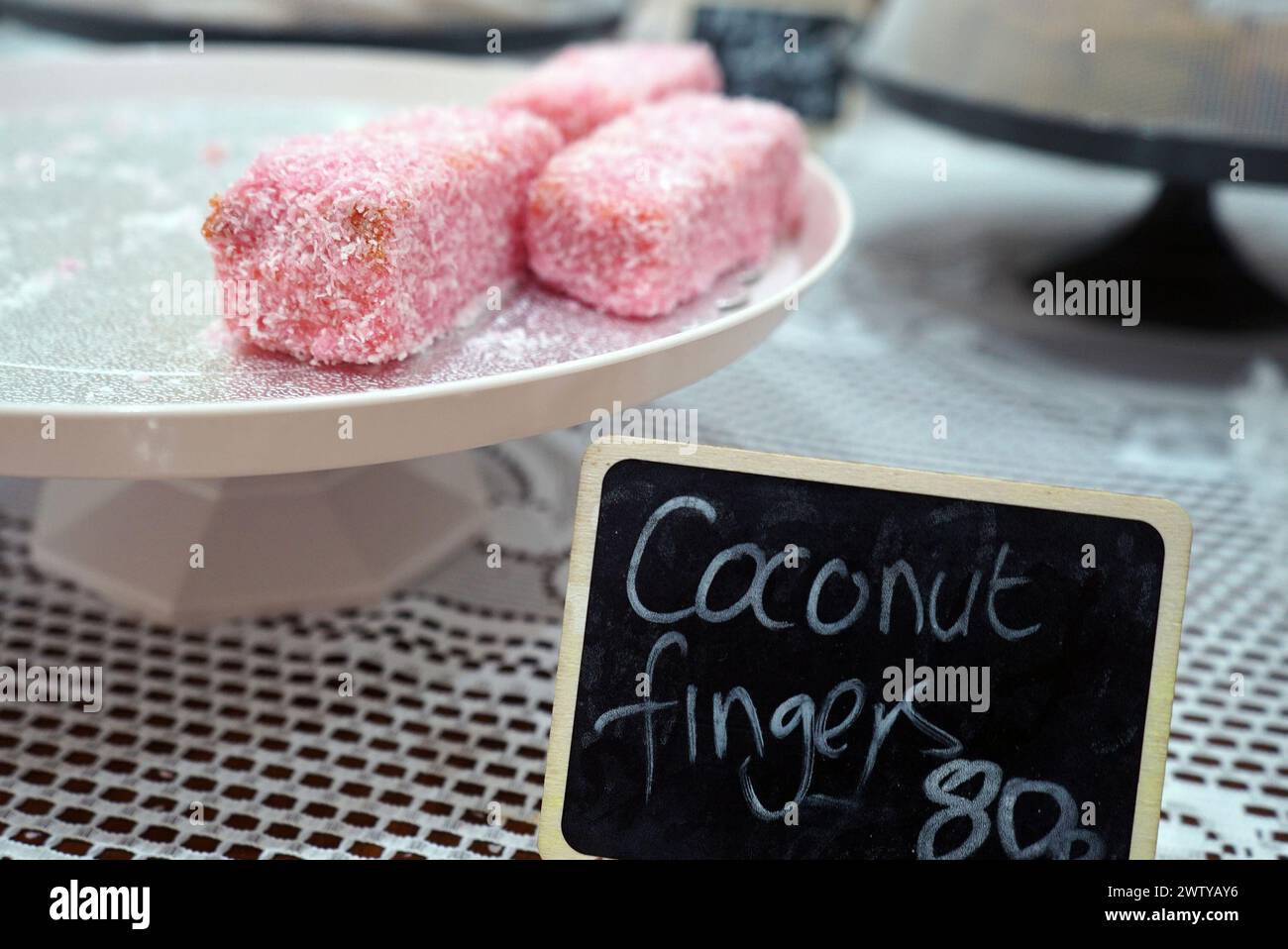 Coconut fingers, a traditional celebration dessert of iced sponge cake ...