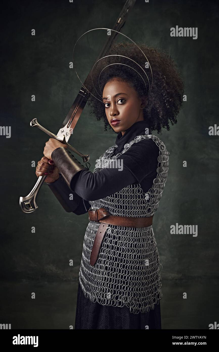 Young African woman, medieval warrior in chainmail armor with halo-like ...