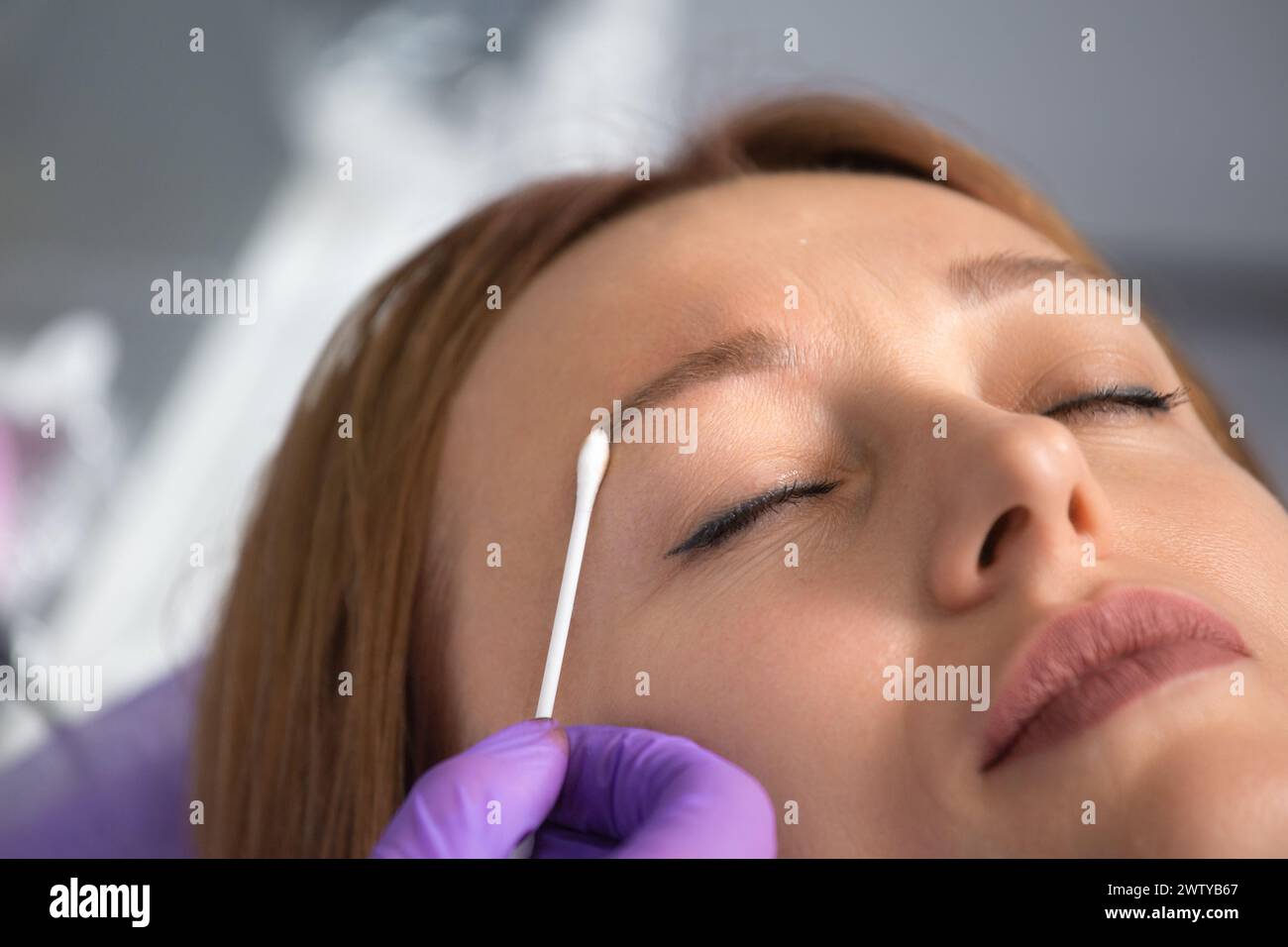 Permanent makeup, eyebrow microblading. A beauty master applies ...