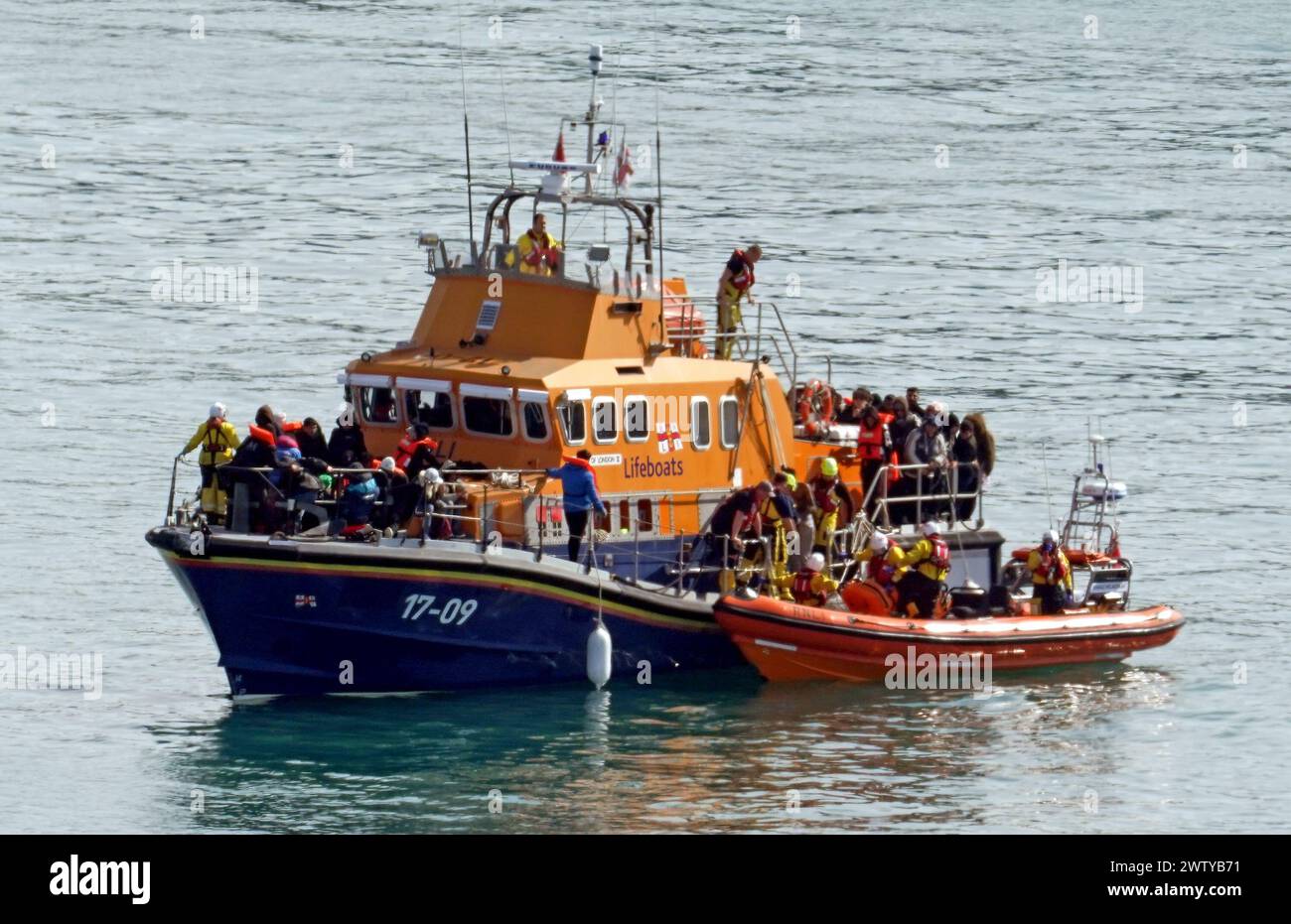 A group of people thought to be migrants are brought in to Dover, Kent ...