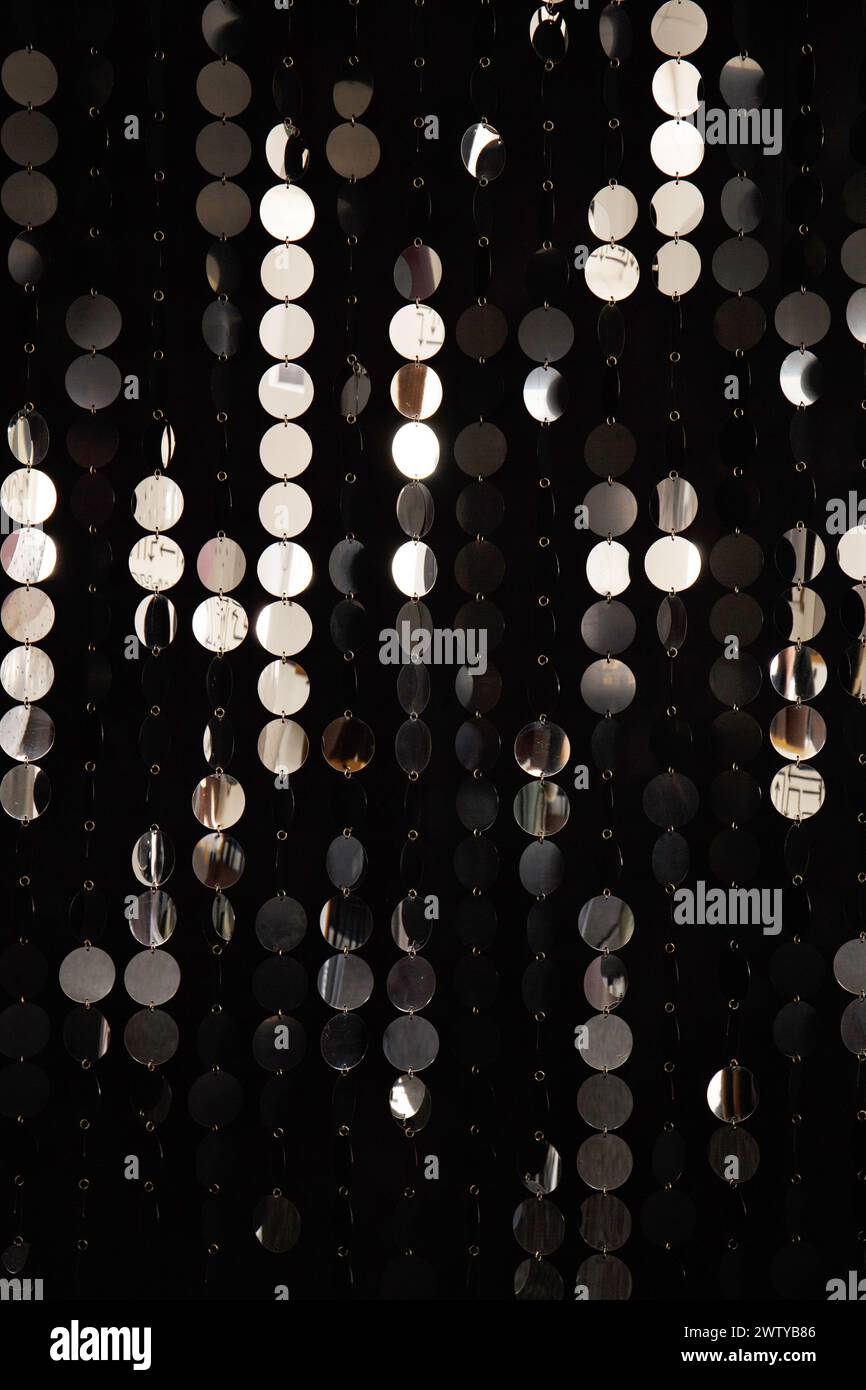 Abstract background with shimmering and shiny silver metal plates discs ...