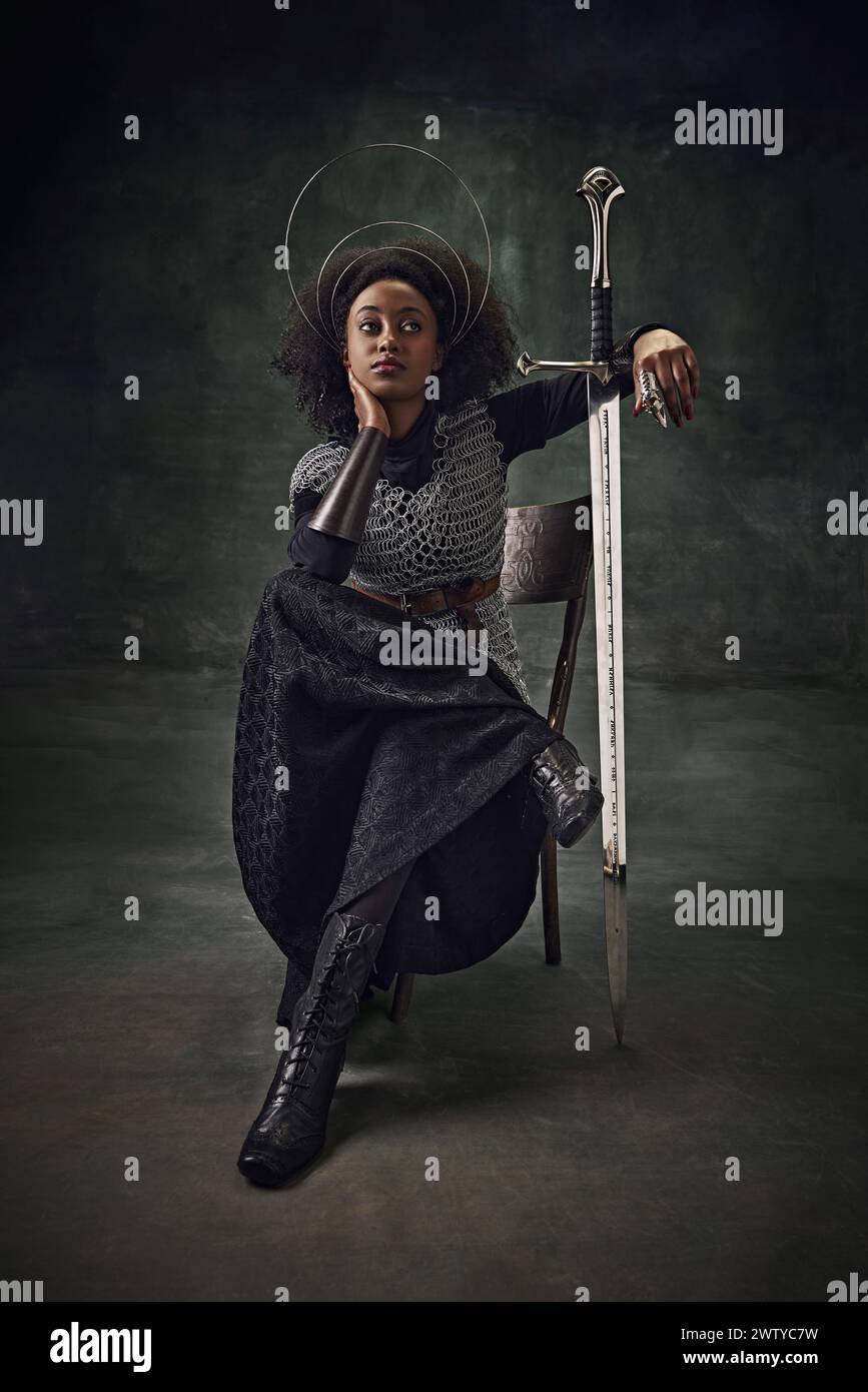 Beautiful young African girl, medieval warrior in chainmail armor with ...