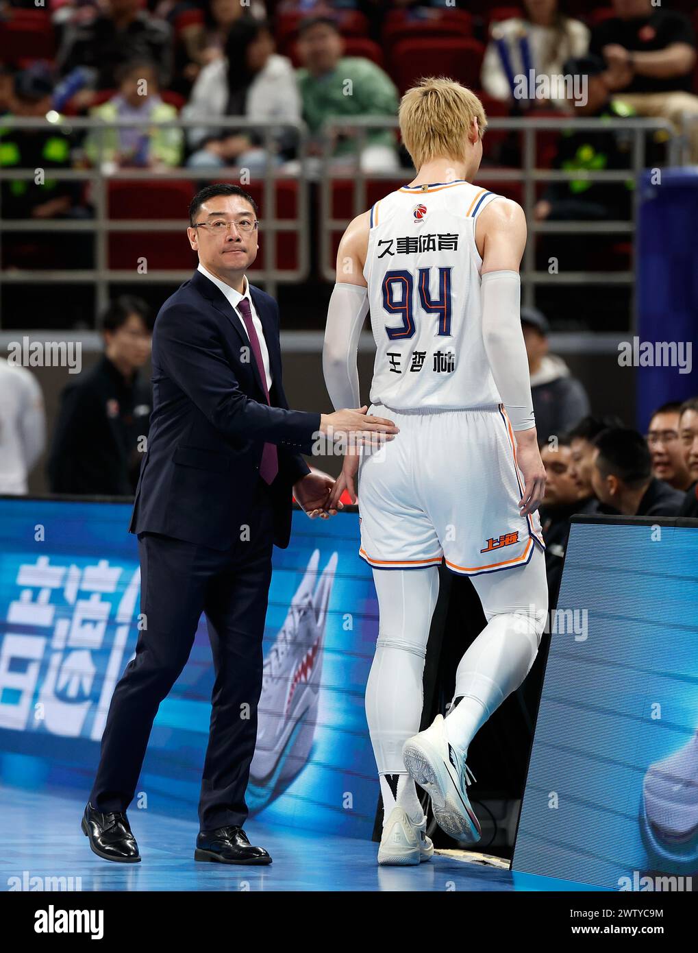 Beijing, China. 20th Mar, 2024. Shanghai Sharks' head coach Liu Peng (L ...