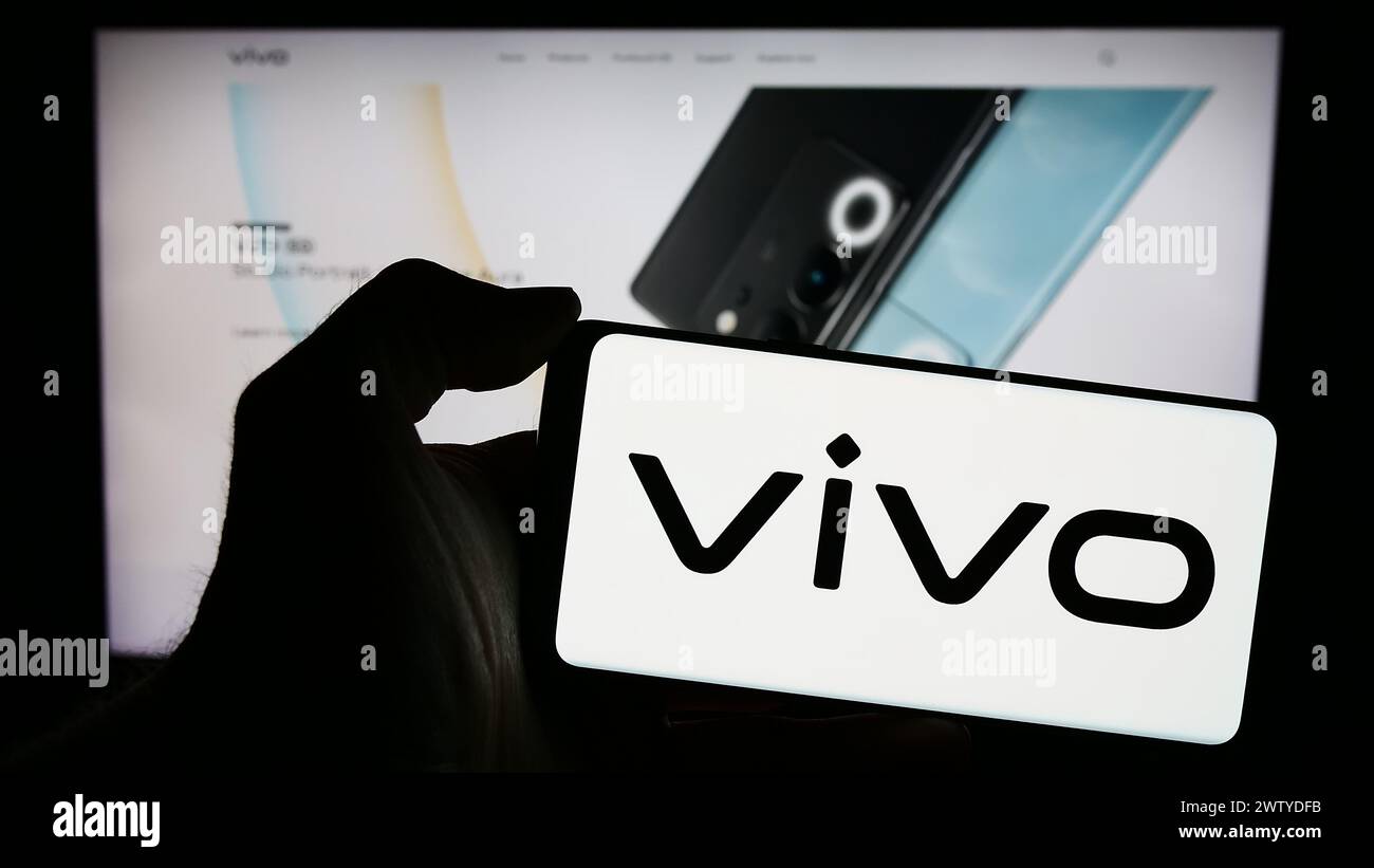 Person holding mobile phone with logo of Chinese company Vivo ...