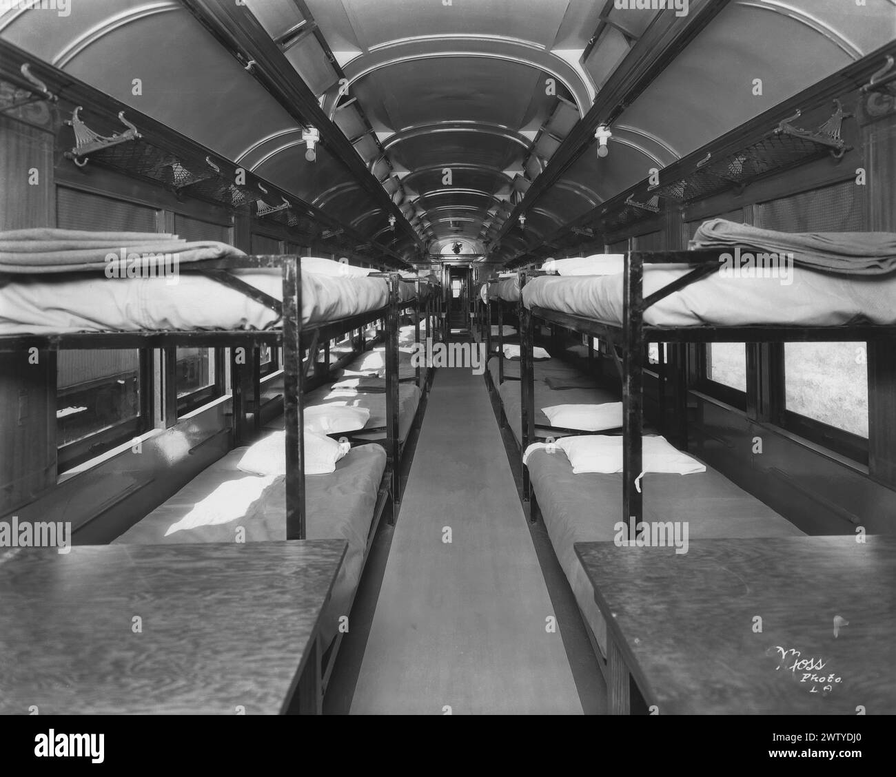 Sleeping car early train showing bunkbeds lining both sides of the ...