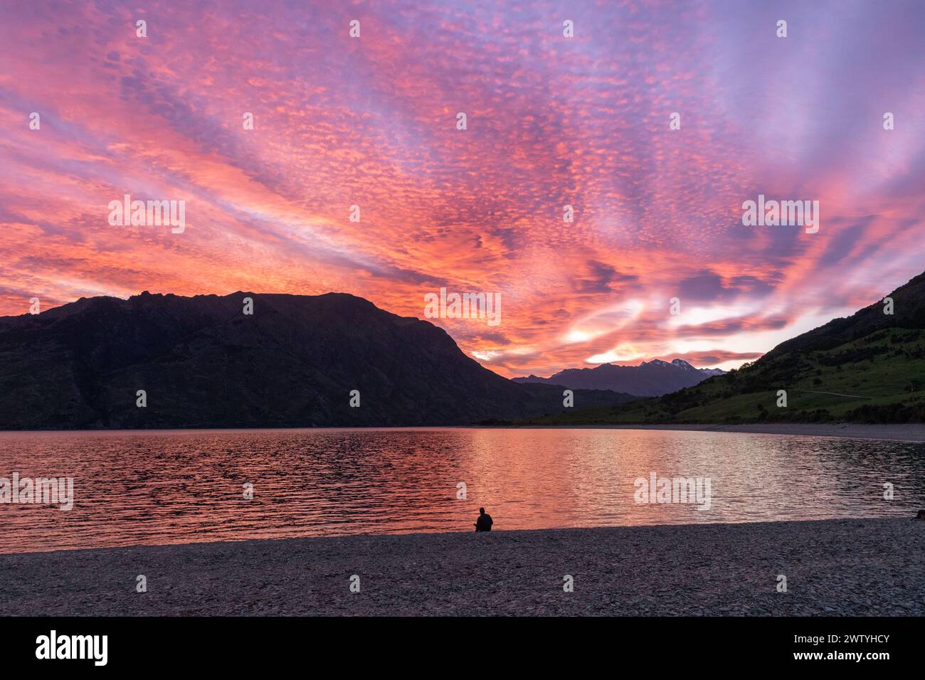 A brilliant sunset over Lake Hawea in the Otago region of southern New ...