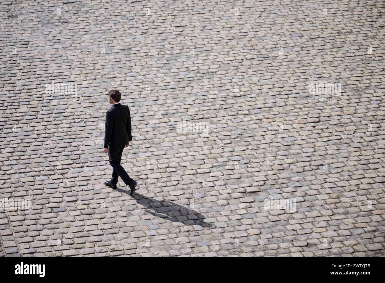 Paris, France. 20th Mar, 2024. France's President Emmanuel Macron walks ...