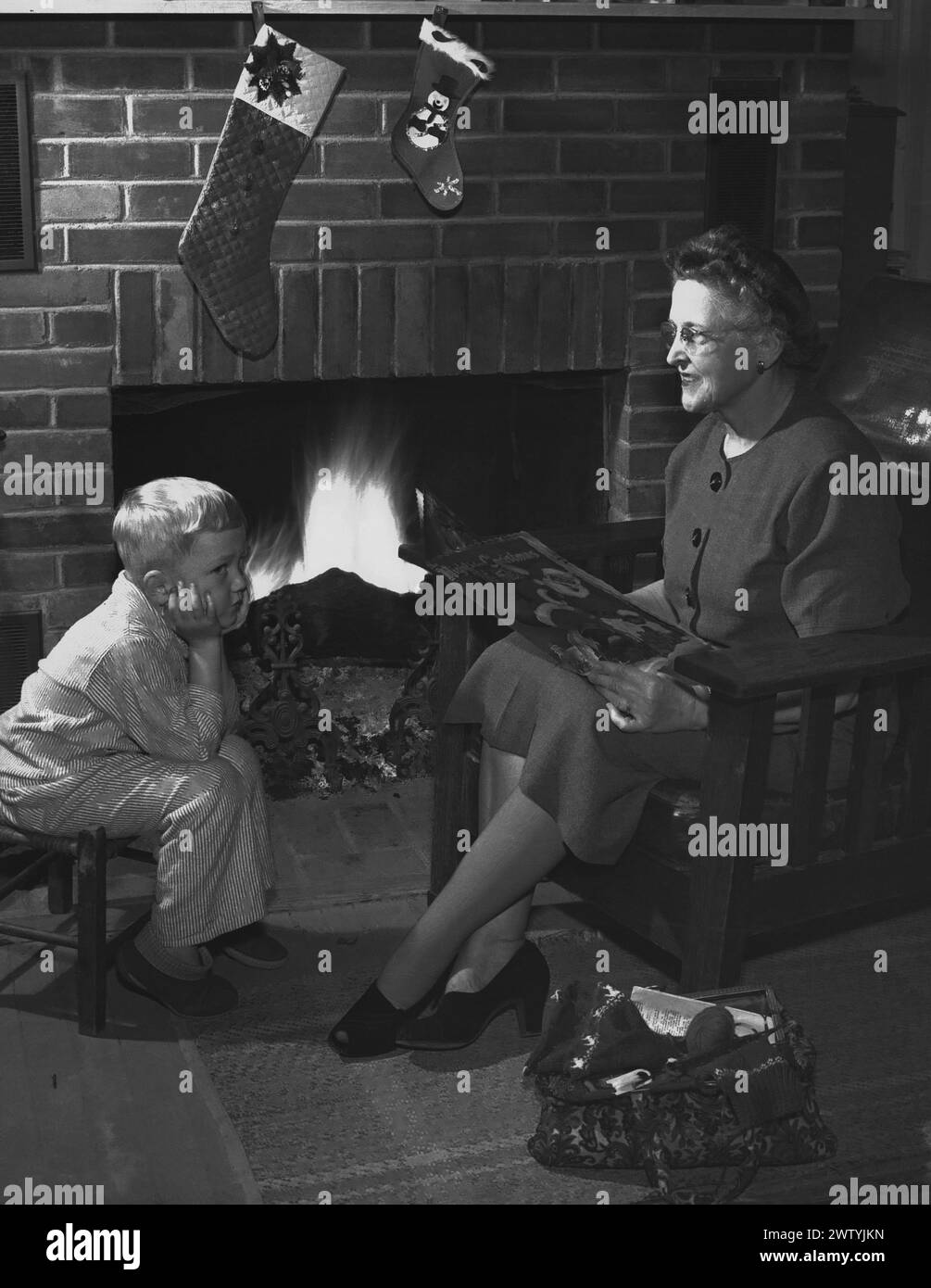Grandmother reading a fireside story to her grandson Stock Photo - Alamy