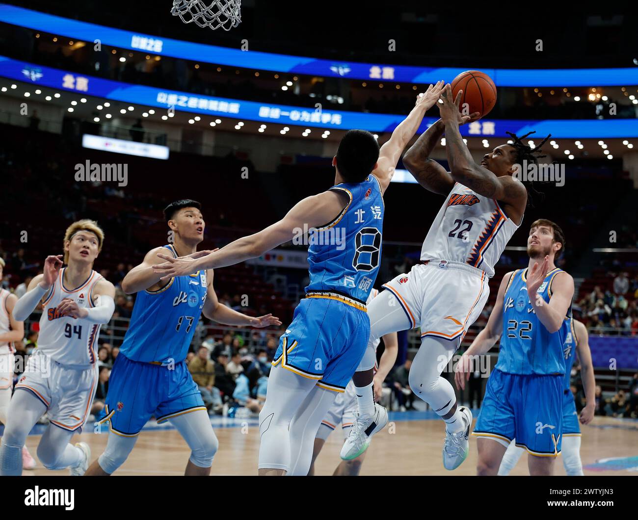 Beijing, China. 20th Mar, 2024. Eric Bledsoe (top) of Shanghai Sharks ...