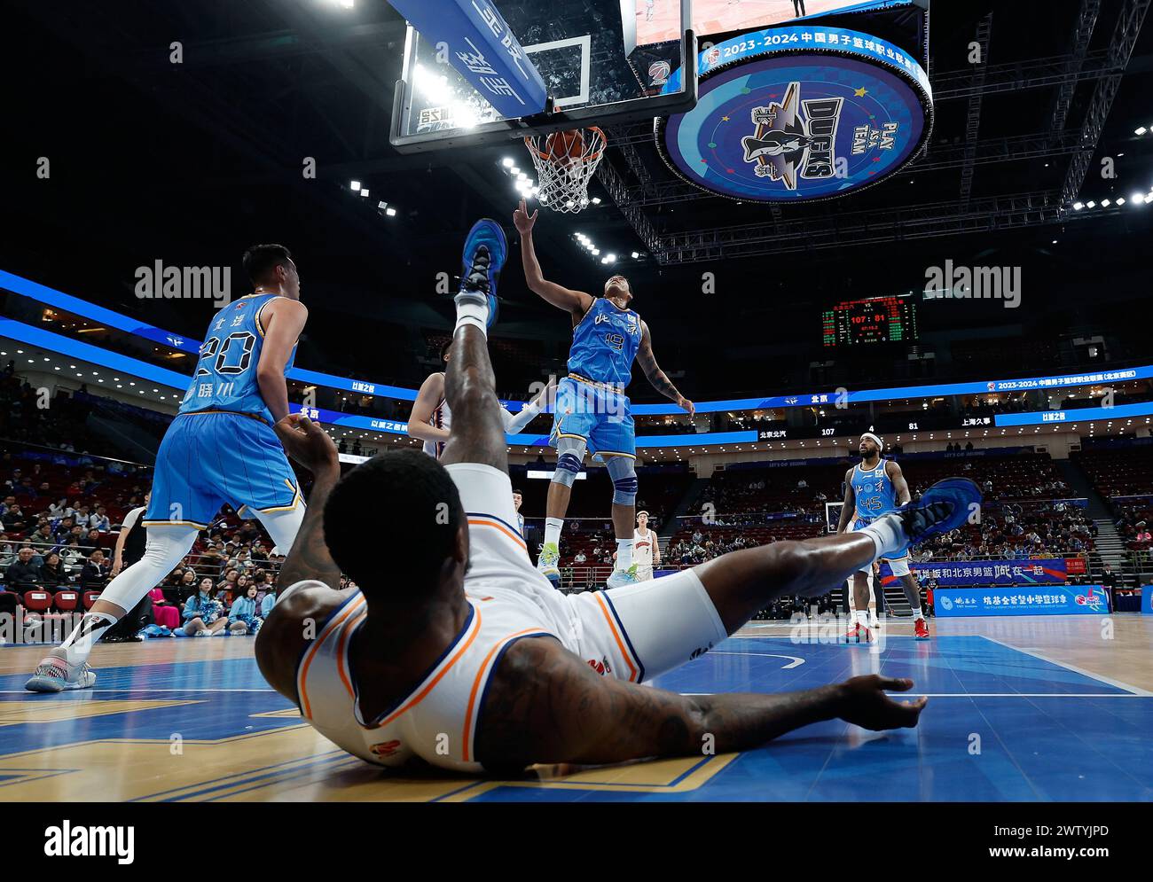 Beijing, China. 20th Mar, 2024. Dwayne Bacon (front) of Shanghai Sharks ...