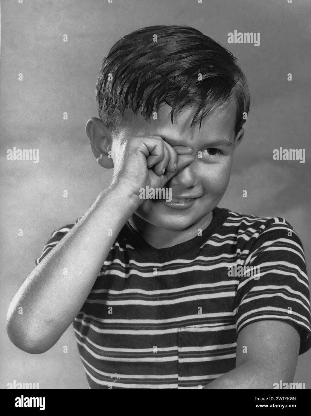 Boy rubbing eye Black and White Stock Photos & Images - Alamy