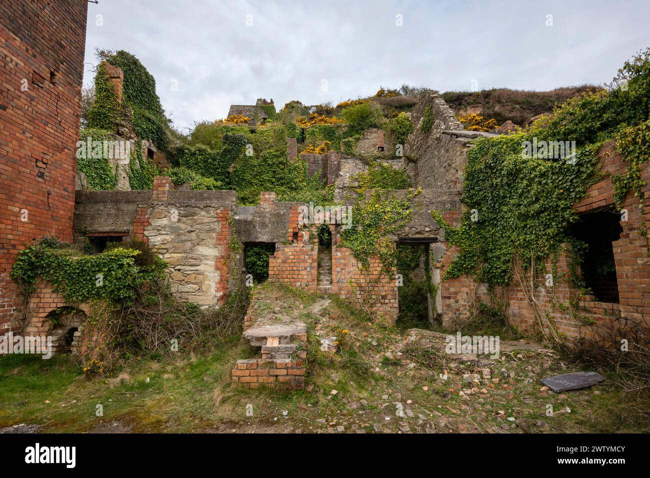 Remains of an old abandoned brickworks at Porth Wen on the North coast ...