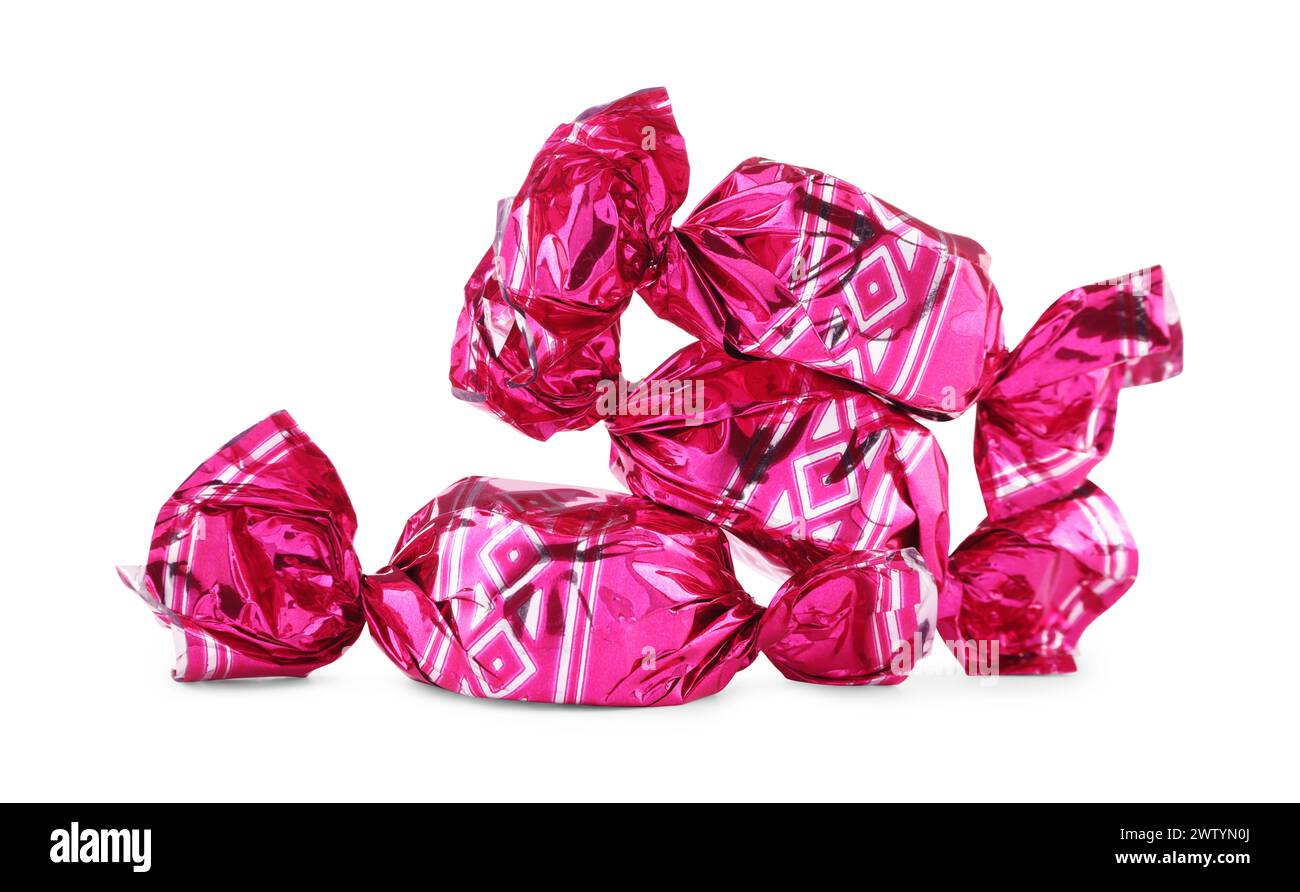Candies in bright pink wrappers isolated on white Stock Photo - Alamy