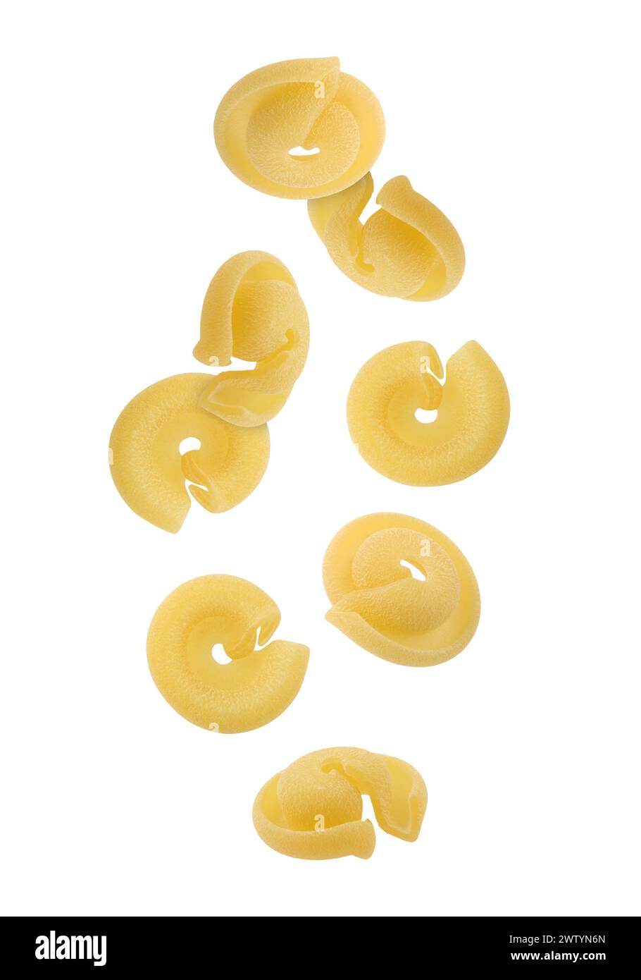 Raw dischi volanti pasta flying on white background Stock Photo - Alamy