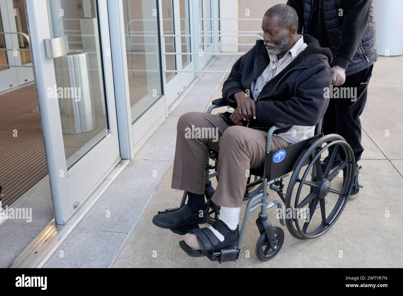 Melvin Jenkins, father of Michael Corey Jenkins, is wheeled into the ...