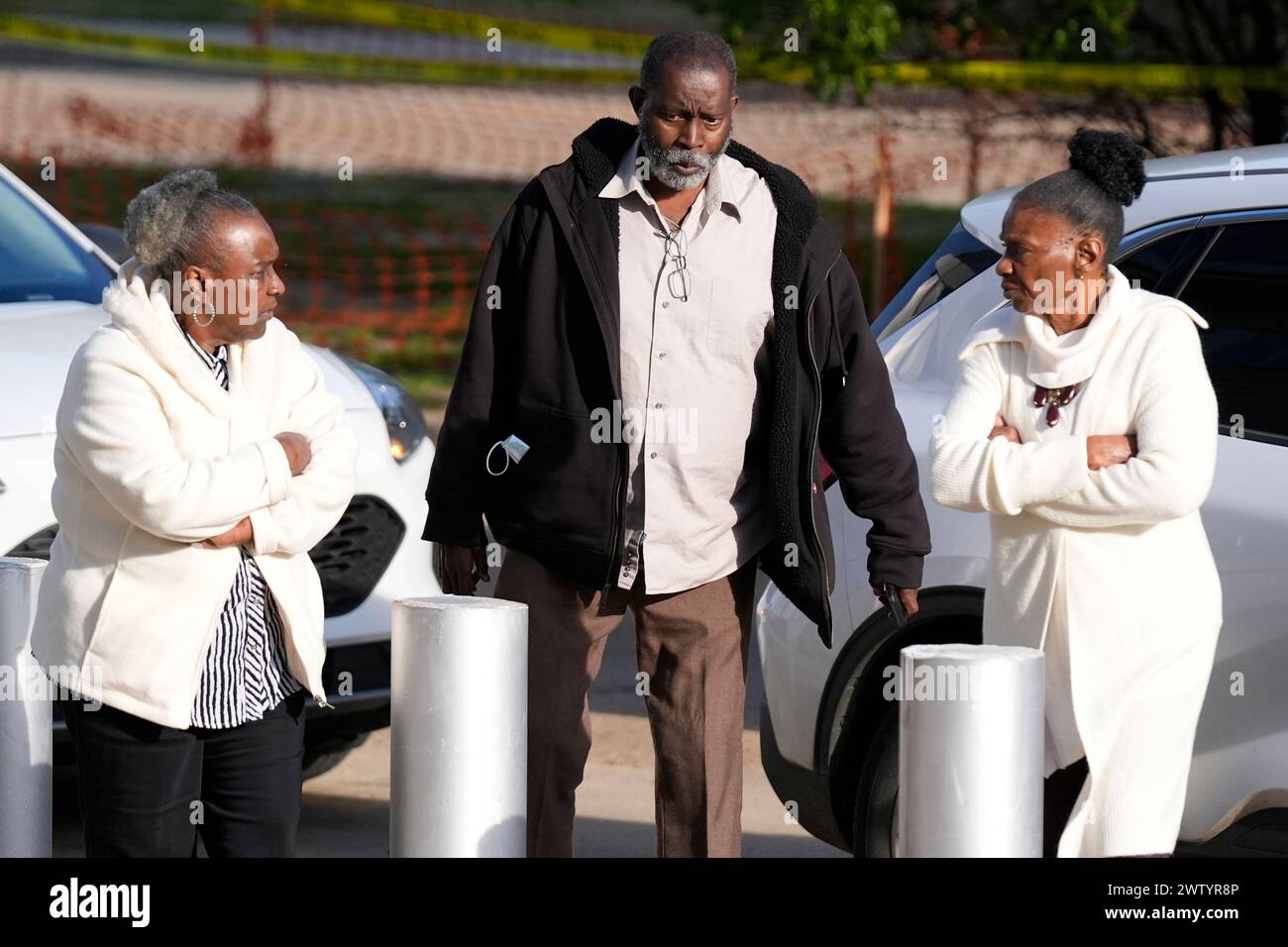 Mary Jenkins, right, and Melvin Jenkins, center, parents of Michael ...