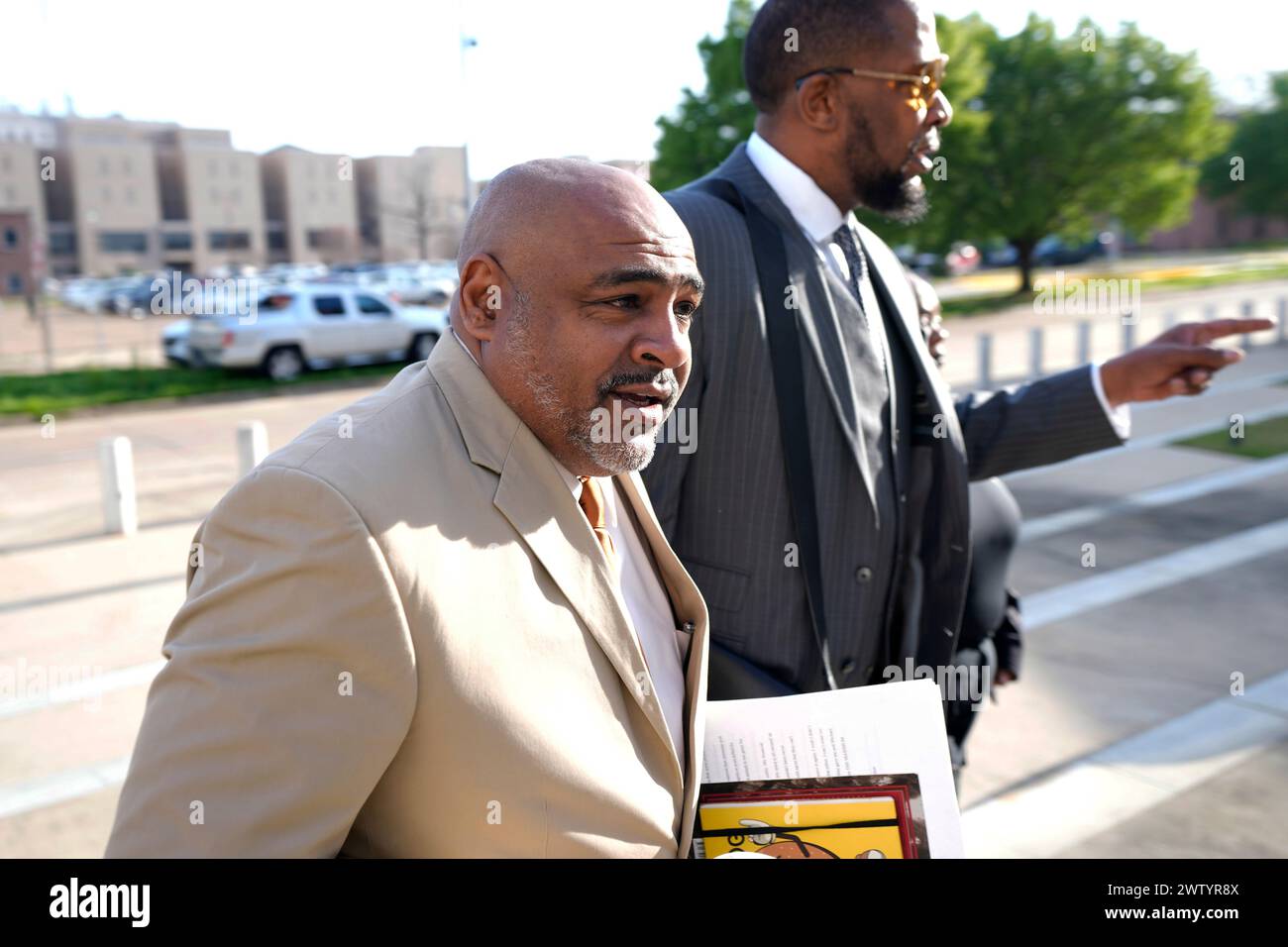Civil co-counsels Trent Walker, left, and Malik Shabazz for Michael ...