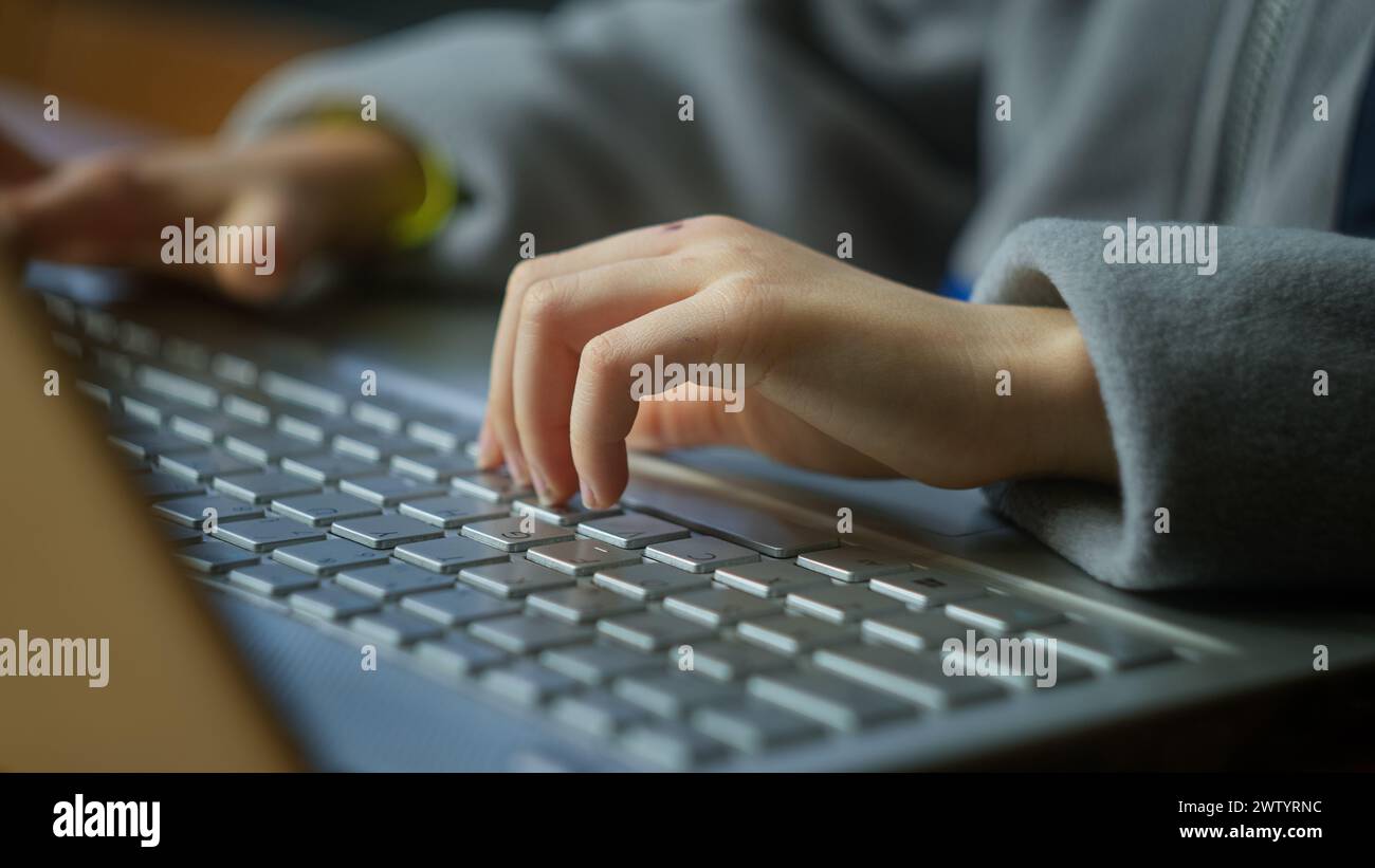 Boy school typing children hi-res stock photography and images - Alamy