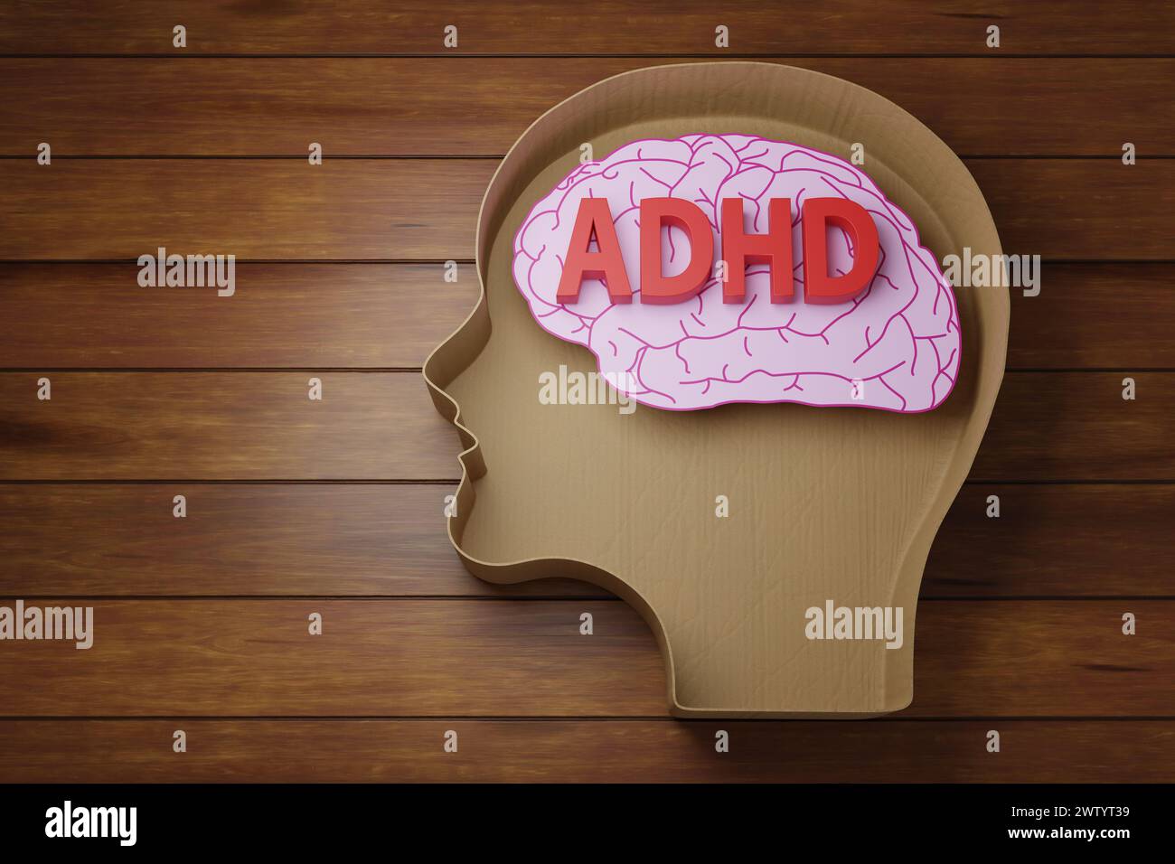 Red letters ADHD on pink brain paper cut in human head shaped brown ...