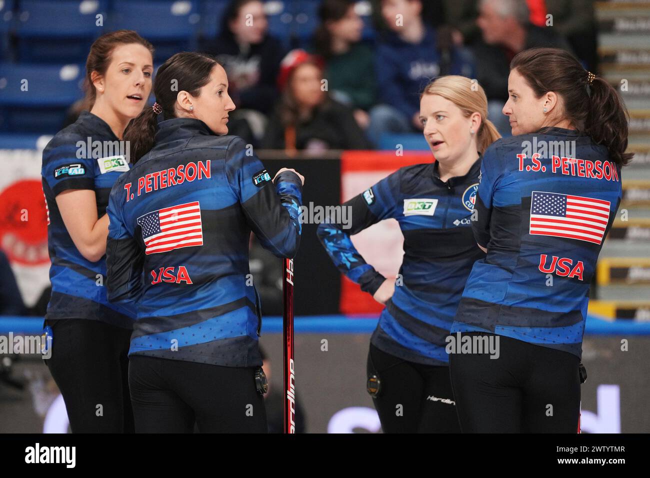 United States skip Tabitha Peterson, second from left, speaks with ...