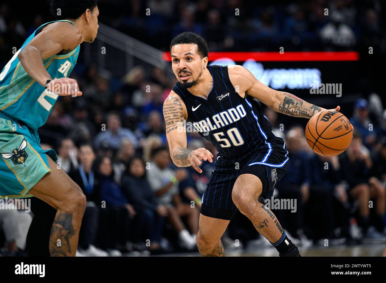 Orlando Magic guard Cole Anthony (50) is defended by Charlotte Hornets ...