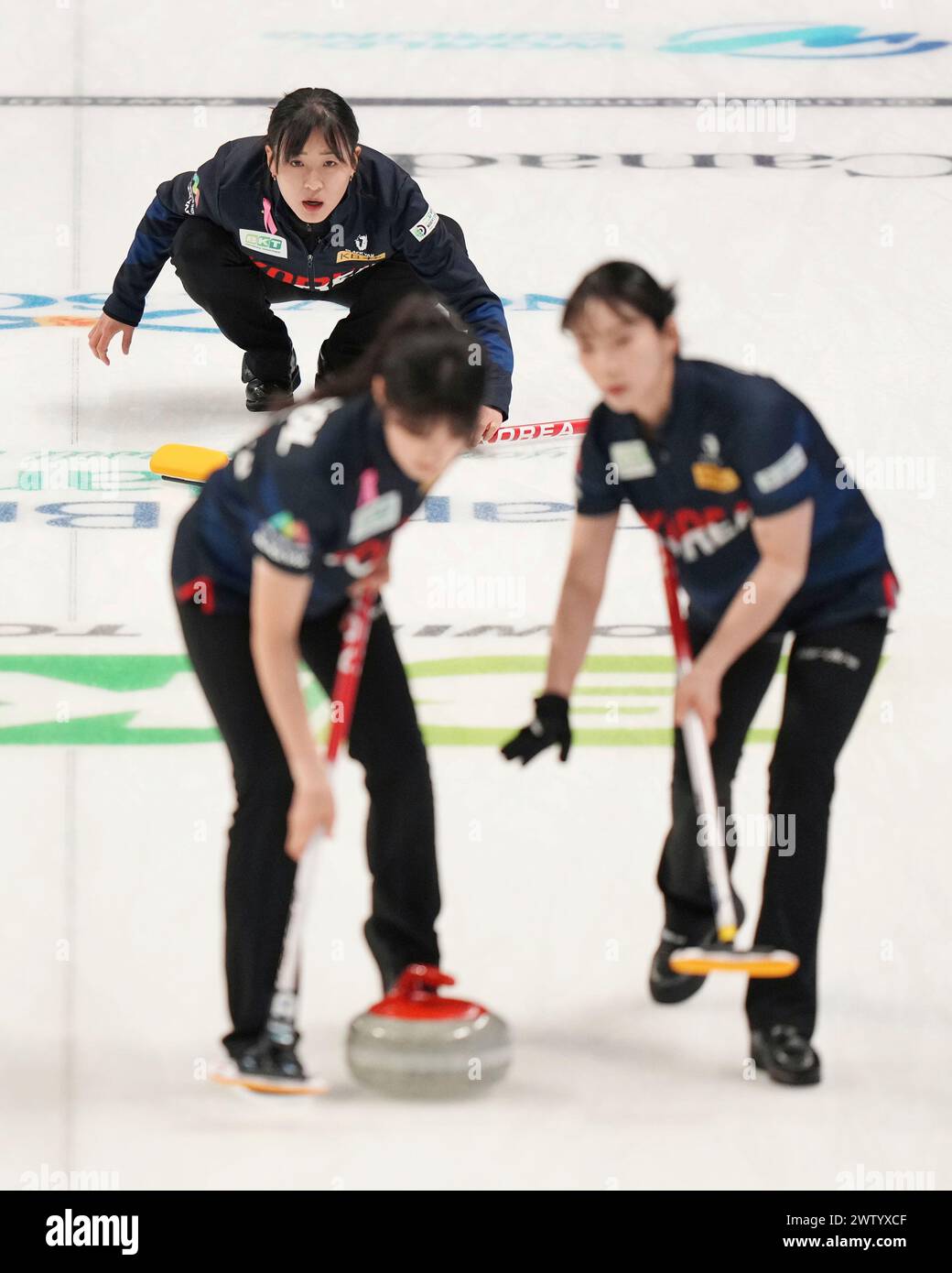 South Korea skip Eunji Gim, top left, directs the line against Italy ...