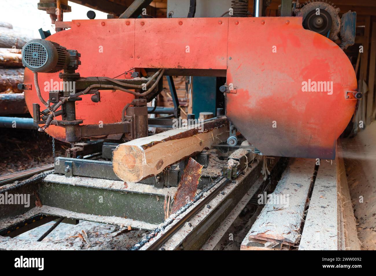 The process of processing wood at a sawmill. Woodworking industry Stock ...