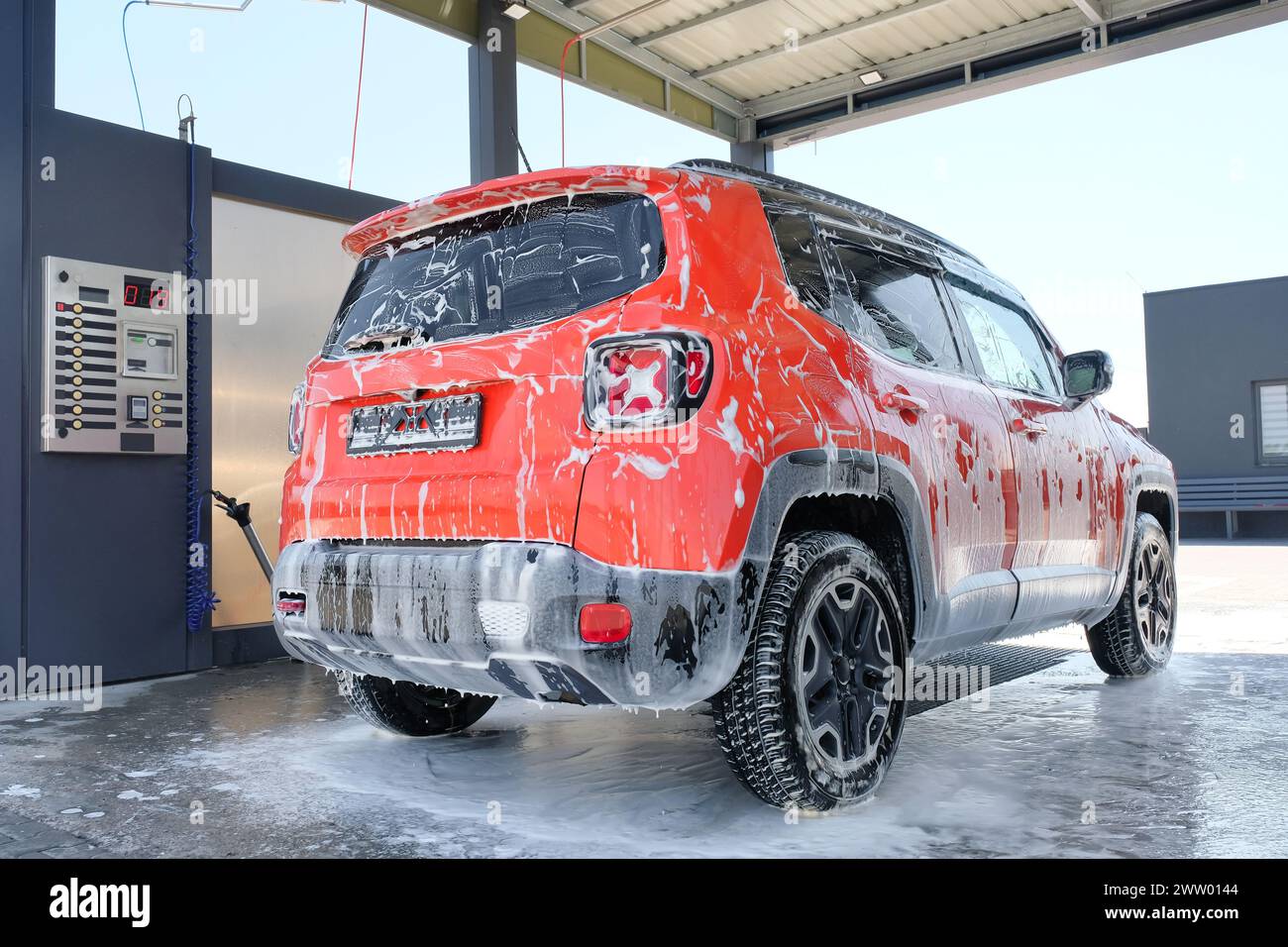 Car in foam. Car getting a wash with soap. Cleaning the car using high ...