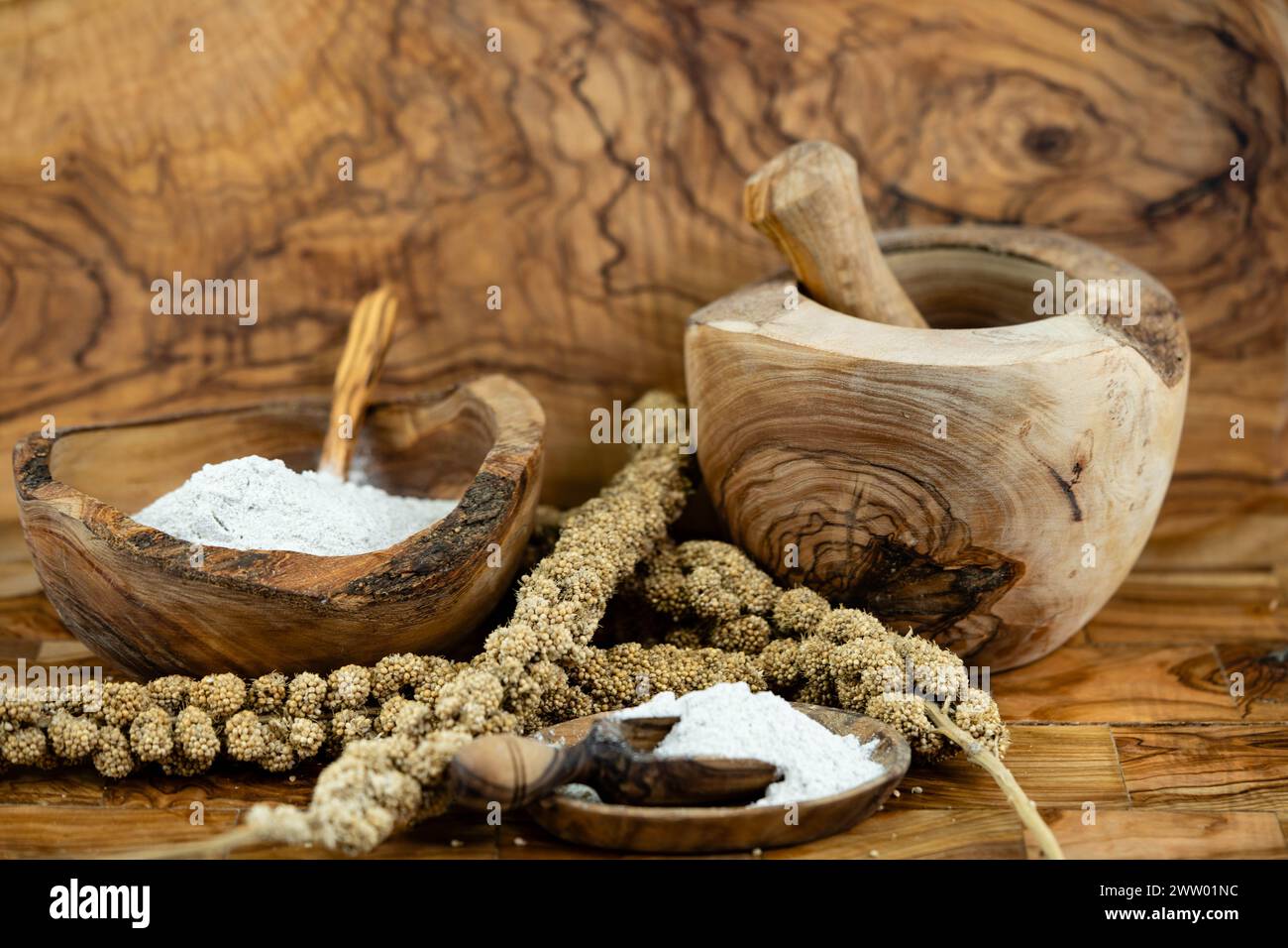 Dried millet flour on olive wood Stock Photo - Alamy