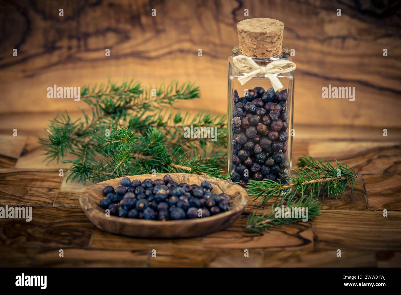 dried juniper berries on olive wood Stock Photo - Alamy